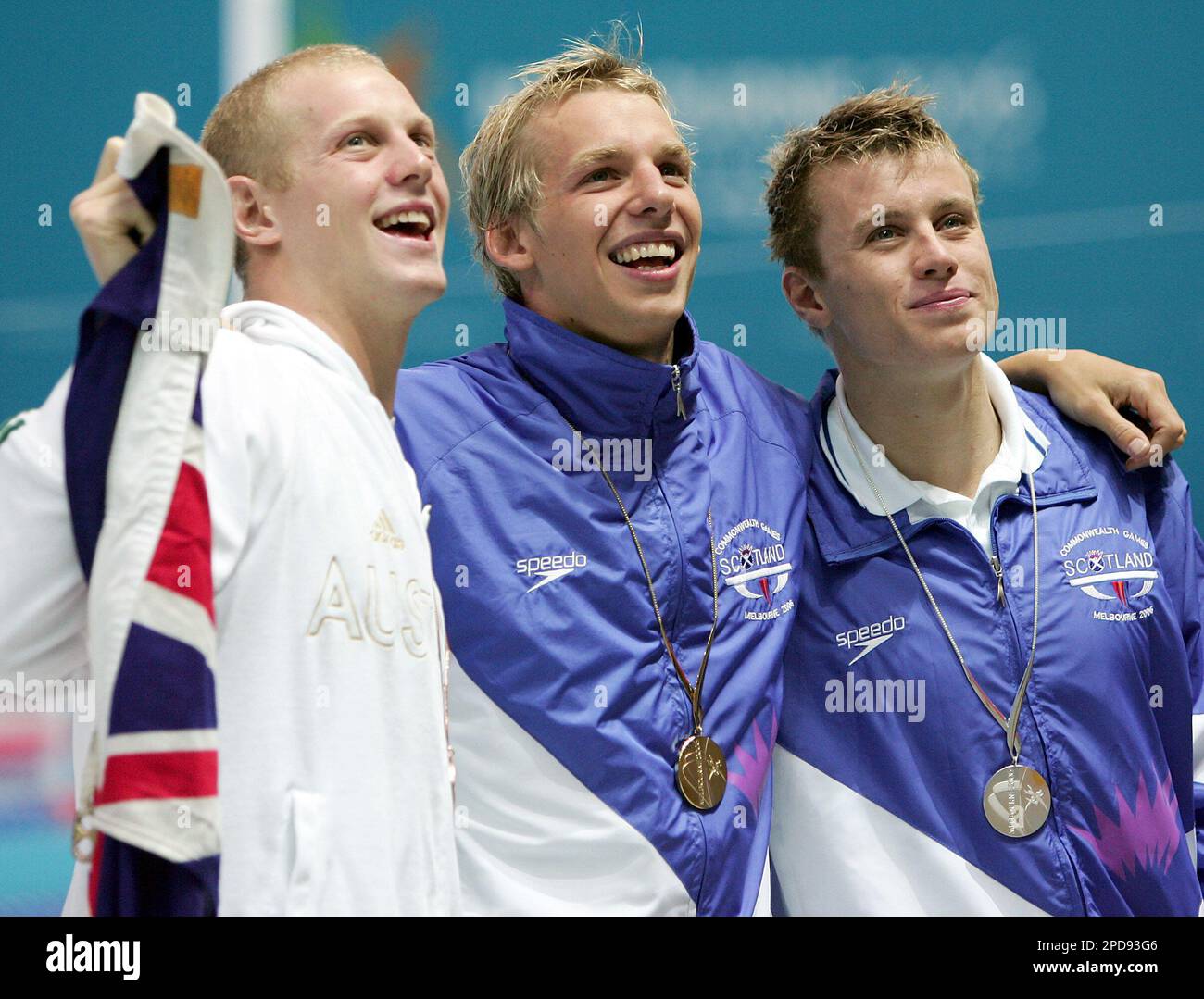 Scotland's David Carry, center, celebrates after receiving the gold ...