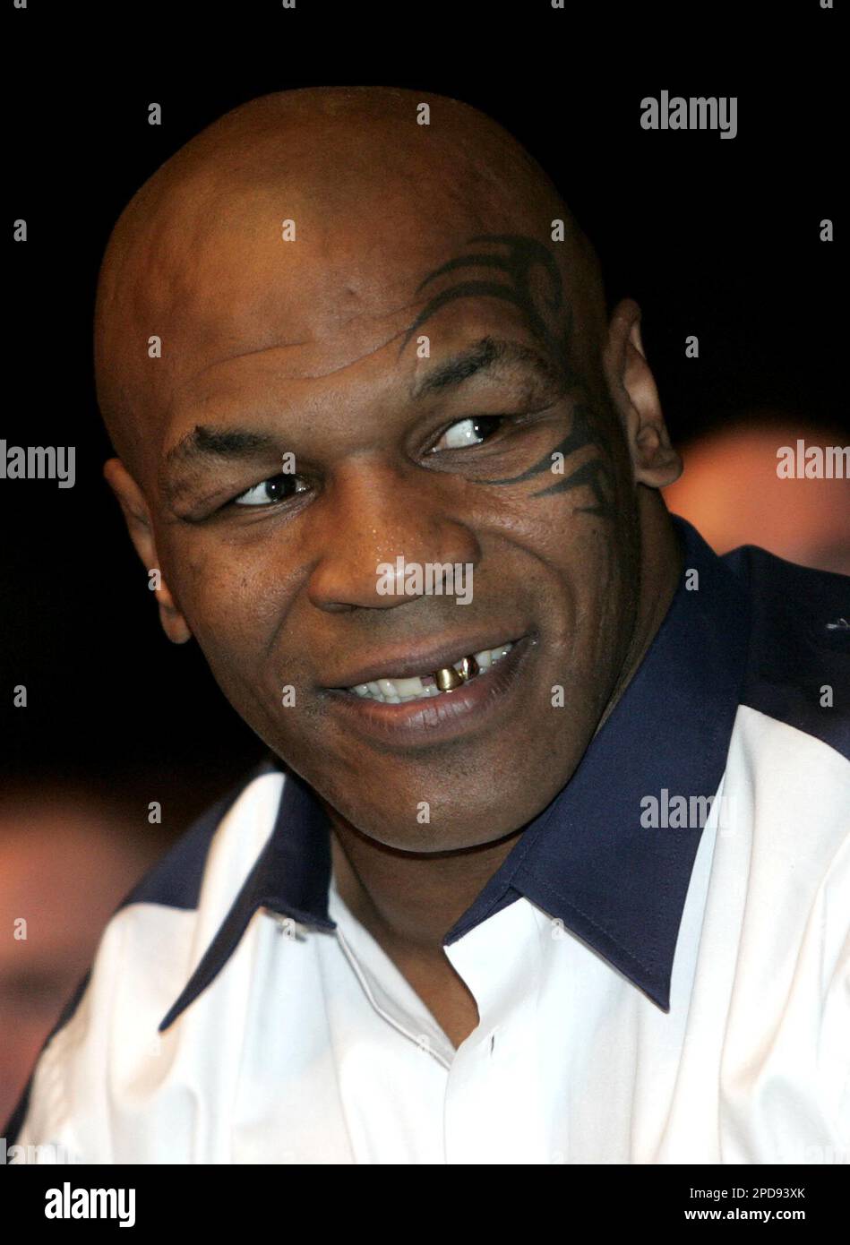 Former boxing World Heavyweight Champion Mike Tyson takes a seat ...