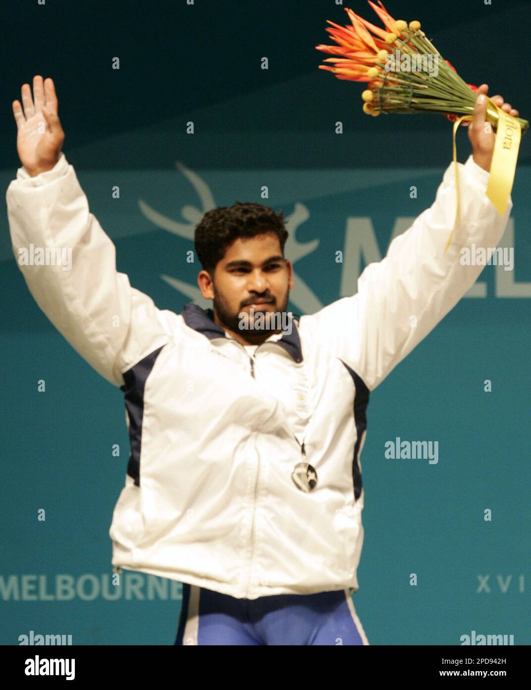 Silver medal winner India's Mohammed Zakir Asdullah waves on the podium ...