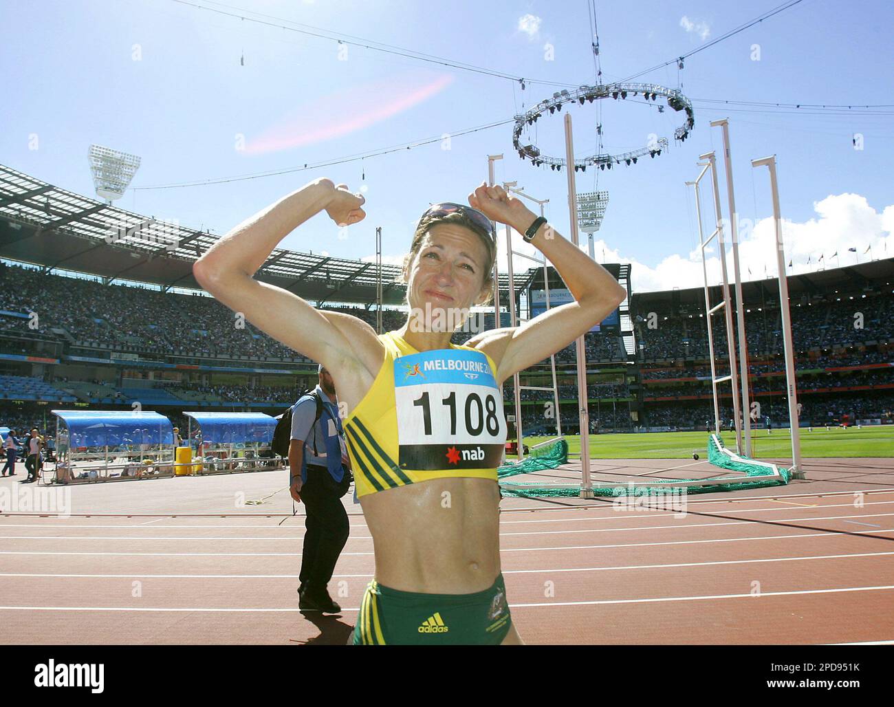 Australia's Kerryn McCann reacts after winning the gold medal in the ...