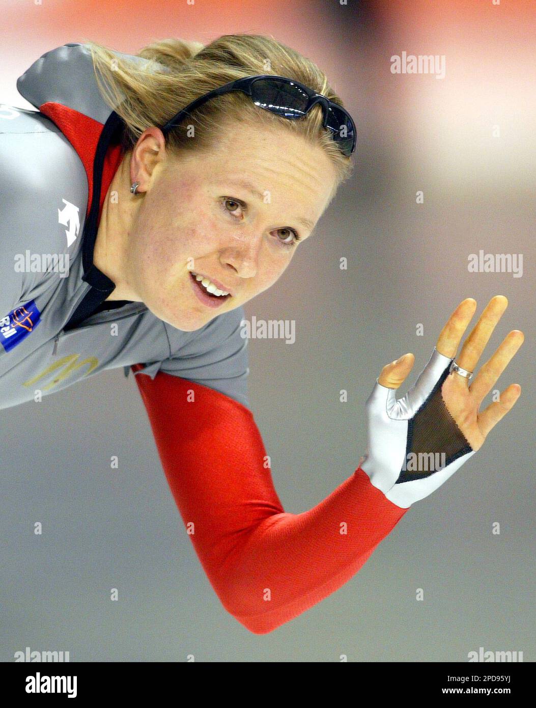 Cindy Klassen, of Winnipeg, Man., waves to the crowd after setting a ...
