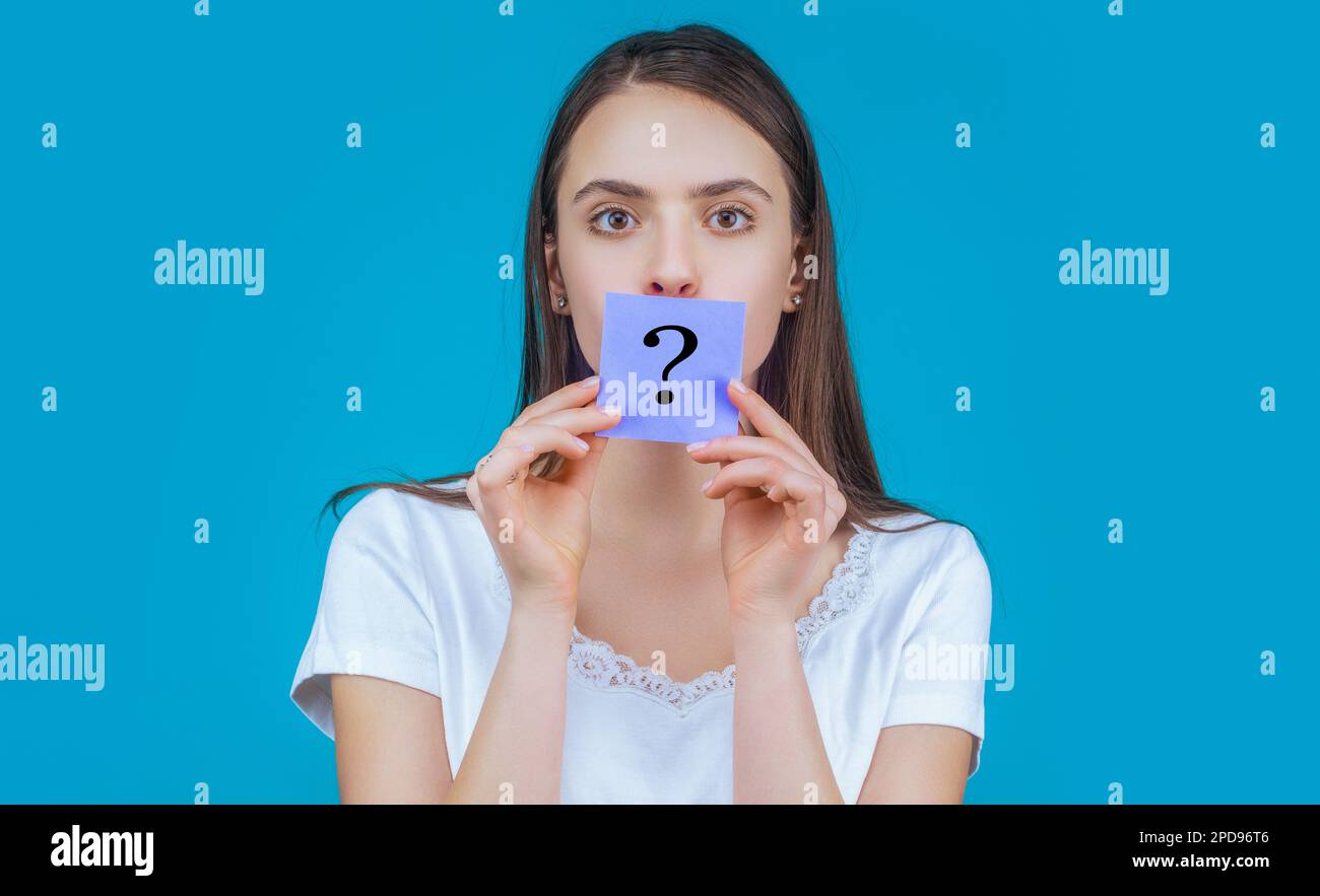 Woman with question mark looking up. Doubtful girl asking questions to ...