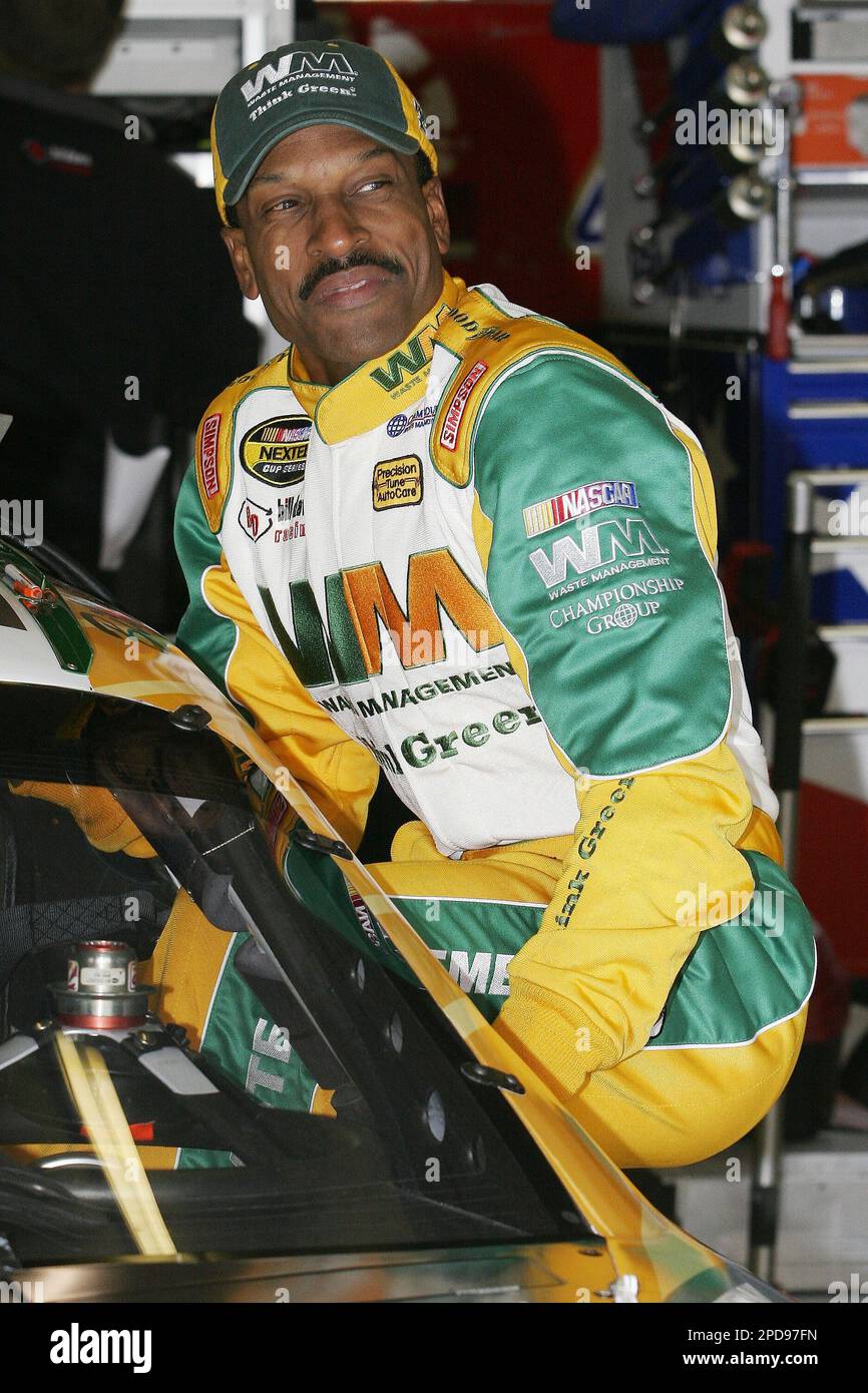 NASCAR driver Bill Lester climbs into is #23 Waste Management race car ...