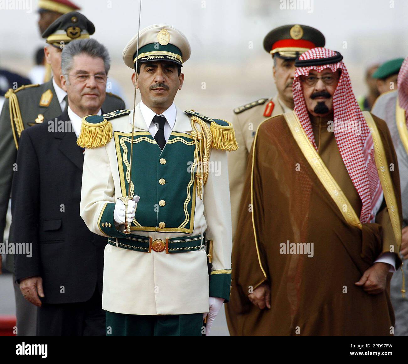 Austrian President Heinz Fischer, left, is welcomed by Saudi Arabian ...