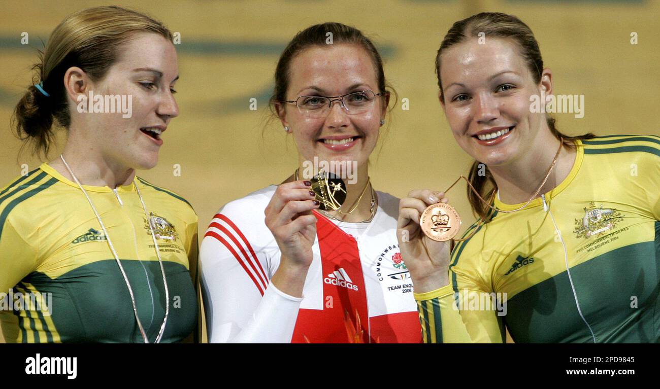 Australian silver medalist Anna Meares ,left, looks at the gold medal ...