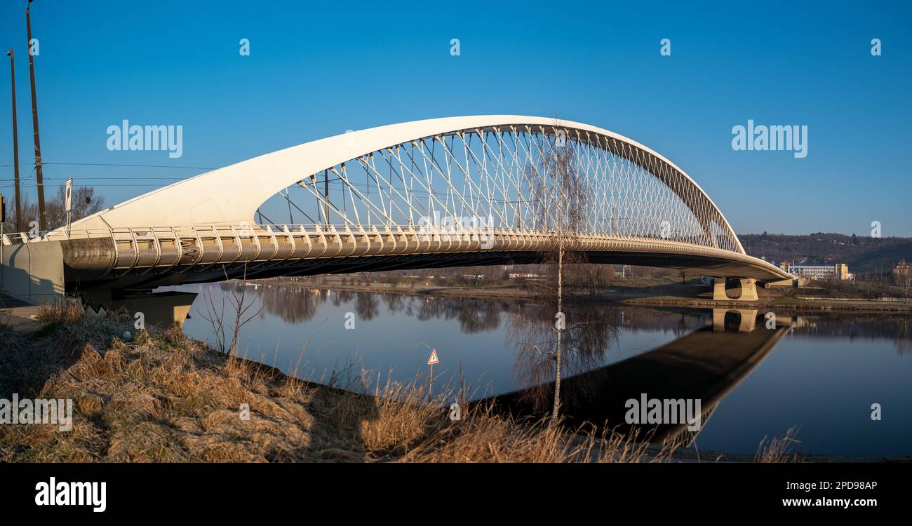 The modern white arched bridge in Prague Trojsky most Stock Photo - Alamy