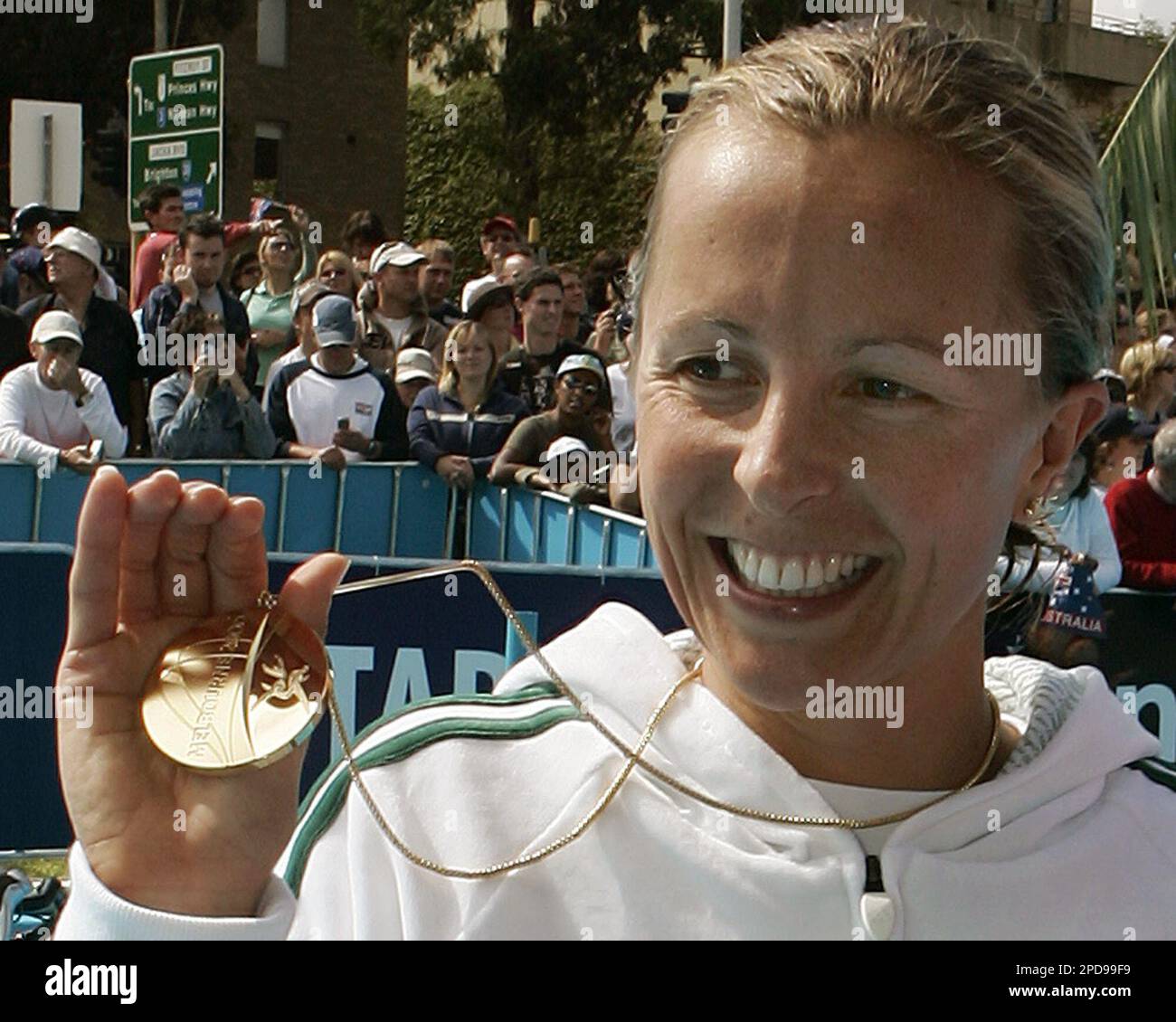 Australian Emma Snowsill shows the gold medal during the medal ceremony ...