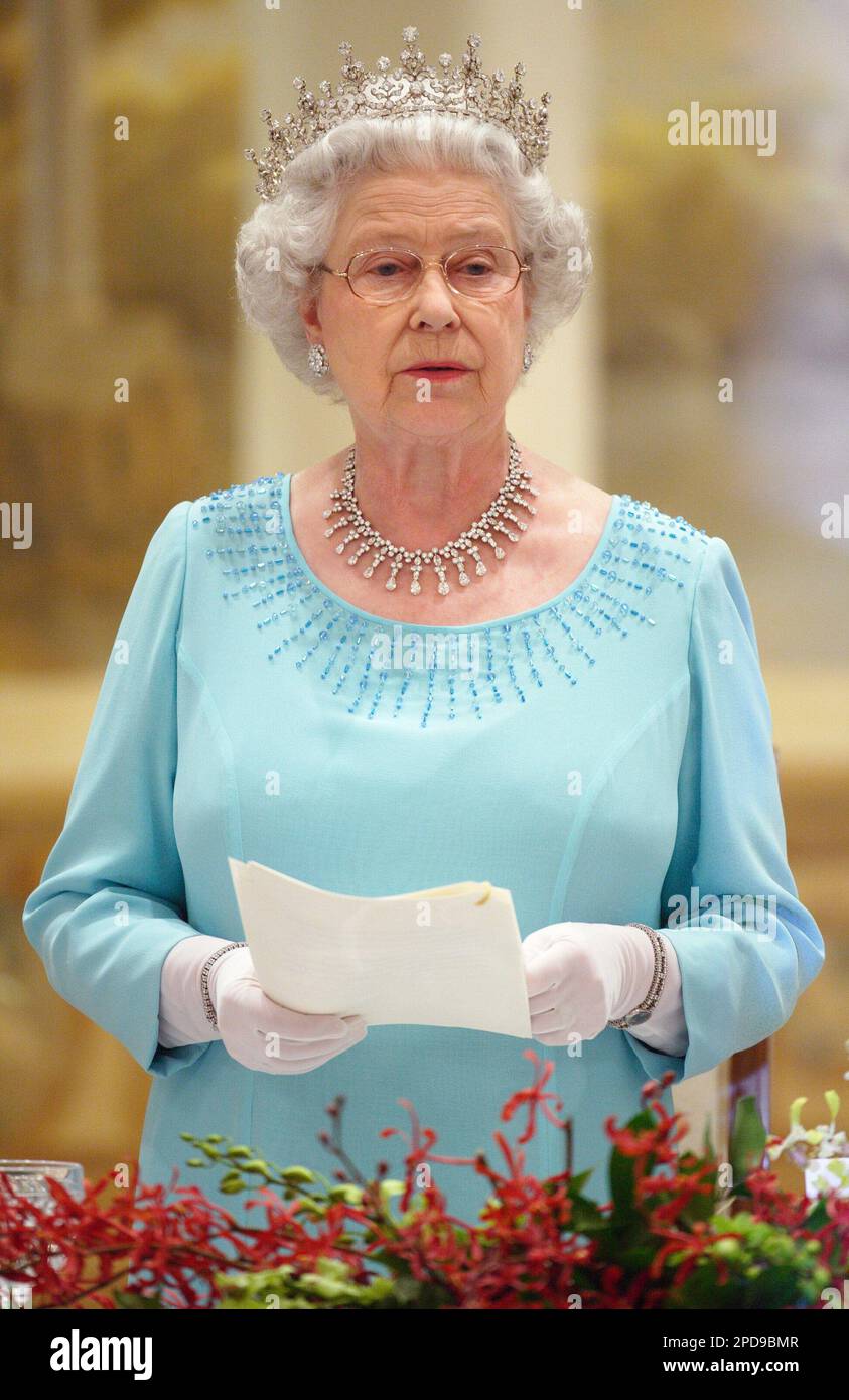 Queen Elizabeth II delivers a speech during a state banquet at the Istana (Presidential Palace ...