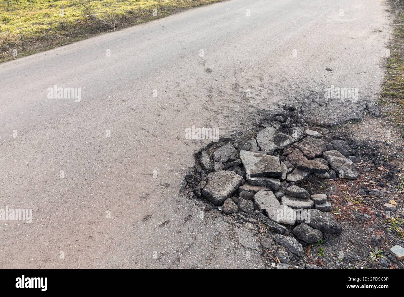 A large number of mine blast traces can be seen on an asphalt road in ...