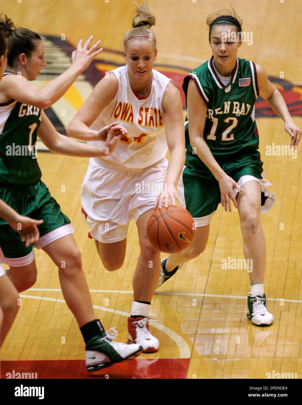 Iowa State's Lyndsey Medders, center, drives between Wisconsin-Green ...