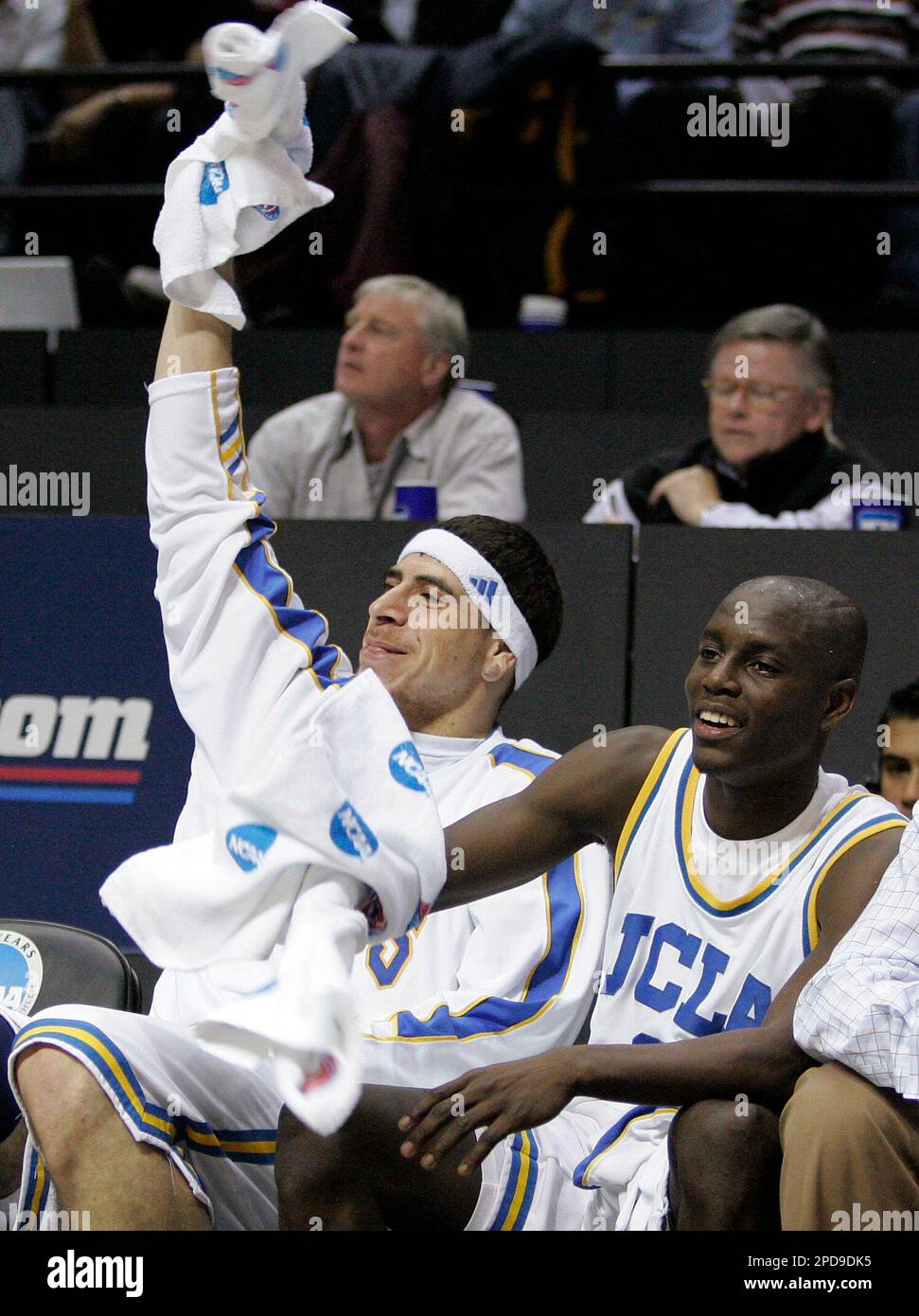 UCLA's Lorenzo Mata, left, and Darren Collison cheer on their teammates ...