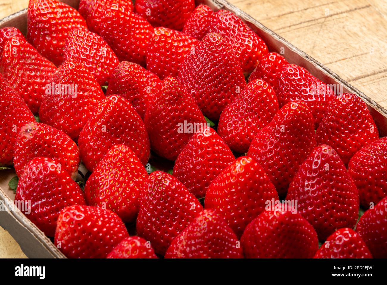 New harvest, 1 kilogram paper box of ripe red sweet Spanish strawberry ...