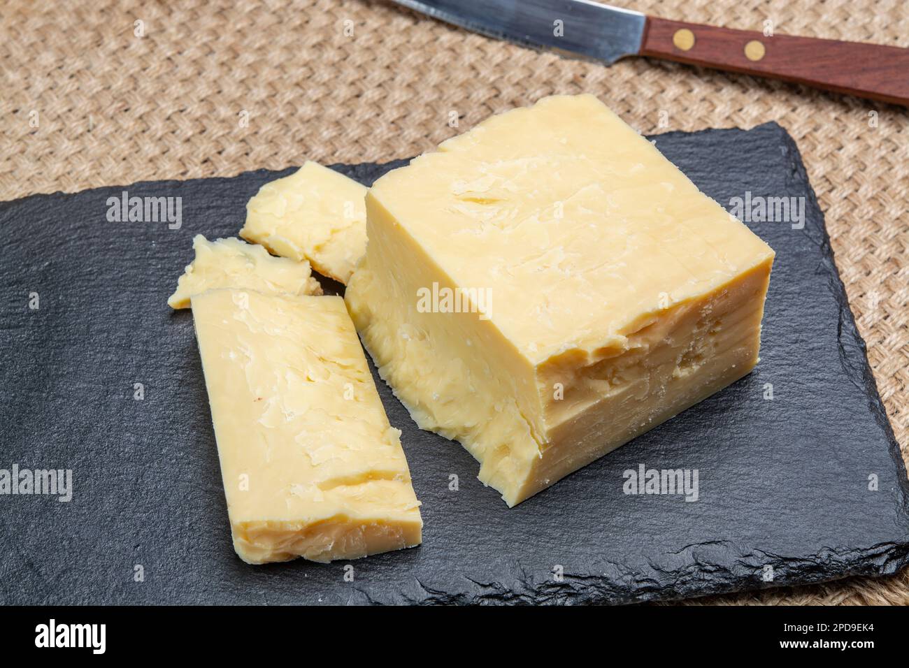 British cheeses collection, English matured smoked cheddar cheese close ...