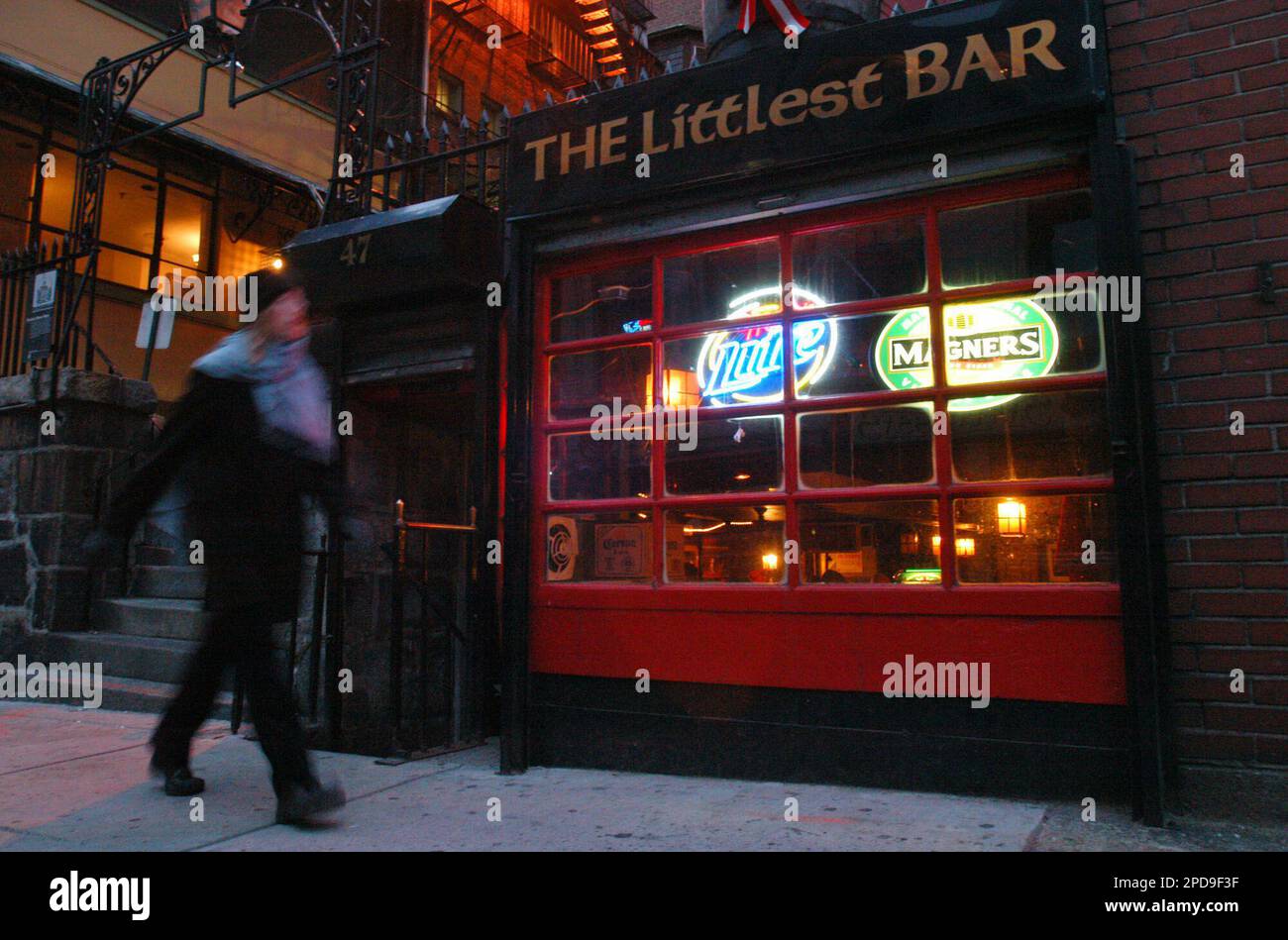 A pedestrian passes The Littlest Bar, in downtown Boston Wednesday ...