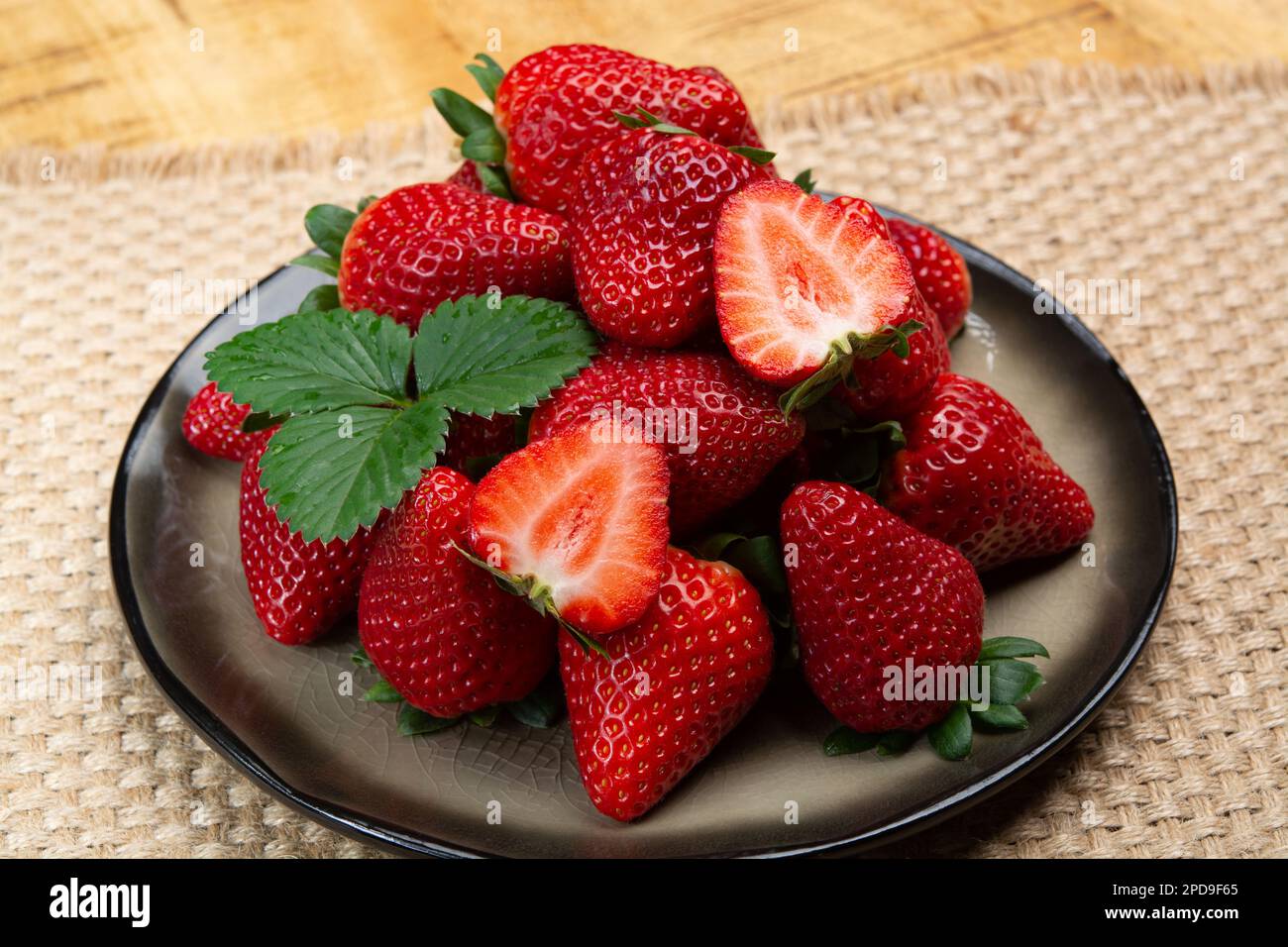 New harvest, board with fresh ripe red sweet Spanish strawberry close ...