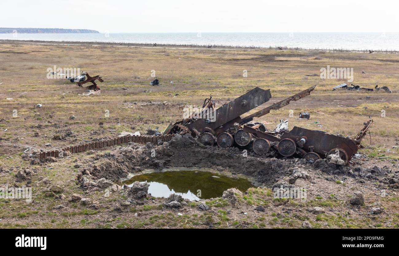 A crater can be seen from the explosion of a shell that destroyed the ...