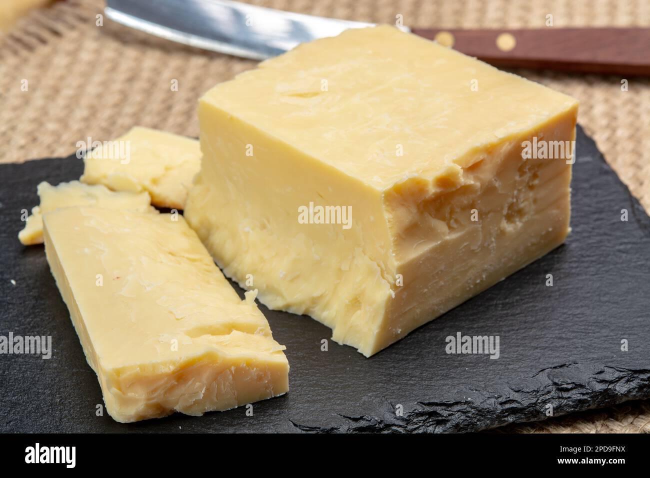 British cheeses collection, English matured smoked cheddar cheese close ...