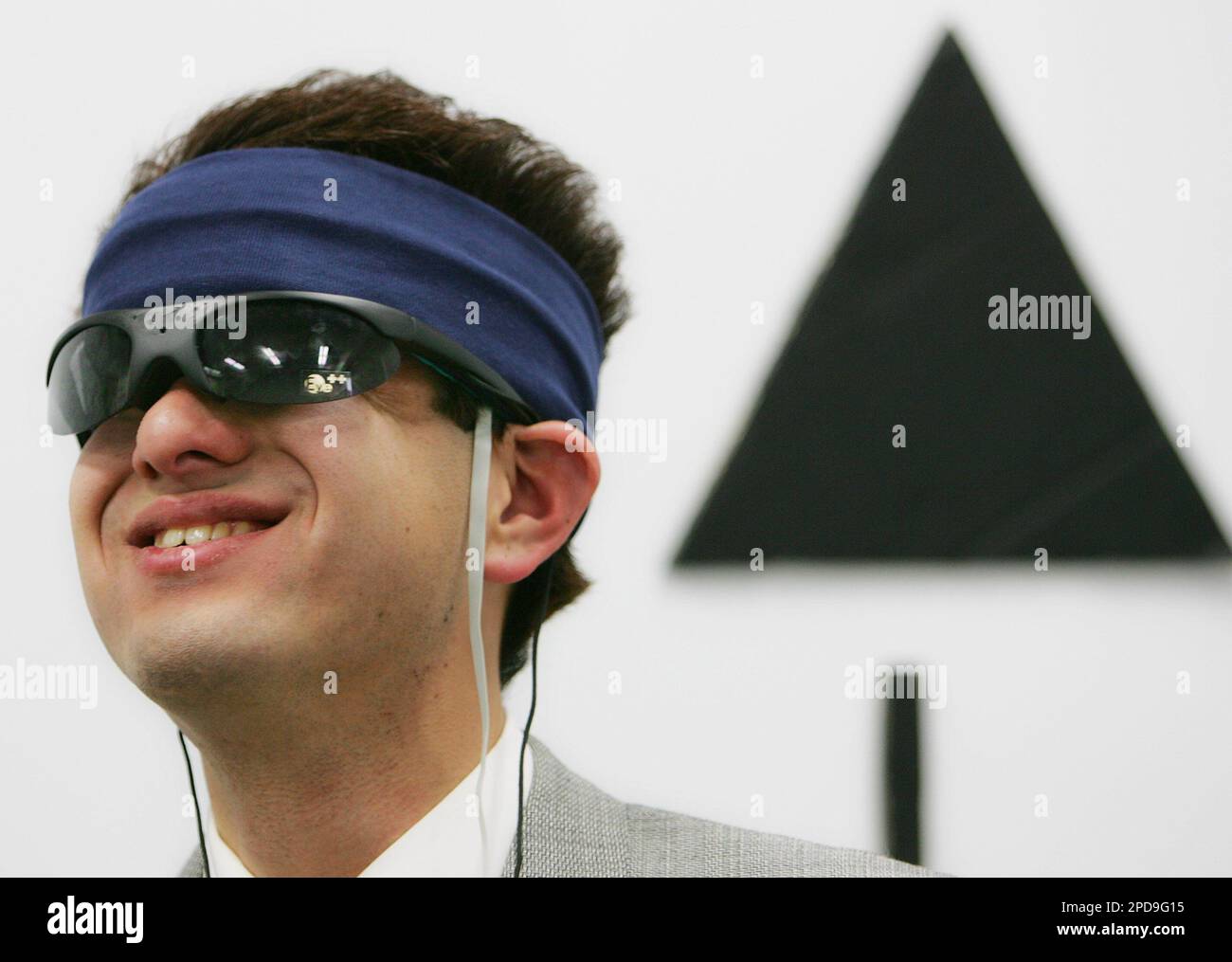 Mitsuhiro Aso, 27, a student of school for the blind, is all smiles as ...