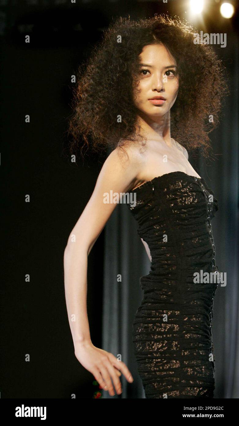 A Taiwanese model hits the catwalk during rehearsal for the opening of ...