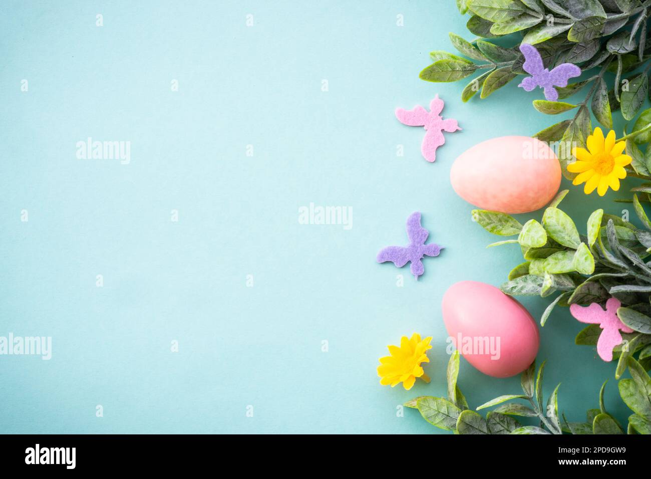 Easter background with Eggs, butterflies and spring flowers at blue ...