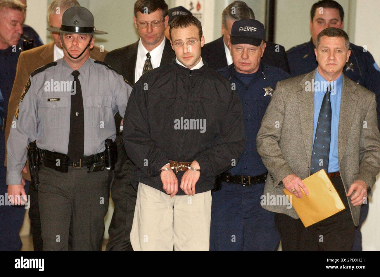 Pennsylvania State Police Escort Hugo Selenski, second left, from his ...