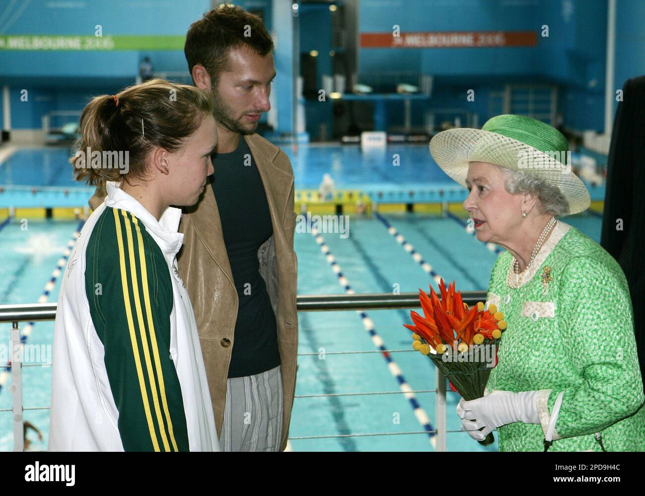 Queen Elizabeth II chats with Australian swimmers Kylie Palmer, left ...