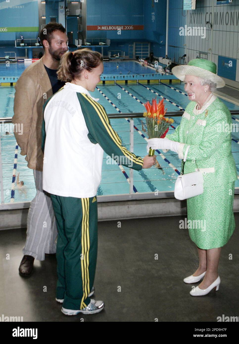 Queen Elizabeth II receives flowers from Australian swim team member ...