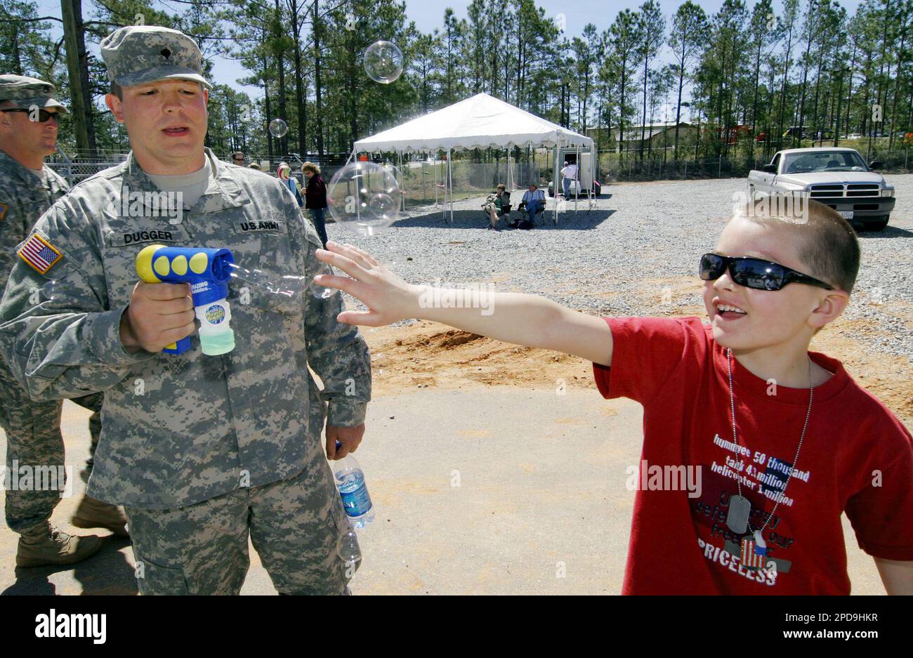 Minnesota National Guard Spec. Jeremy Dugger, left, demonstrates the ...