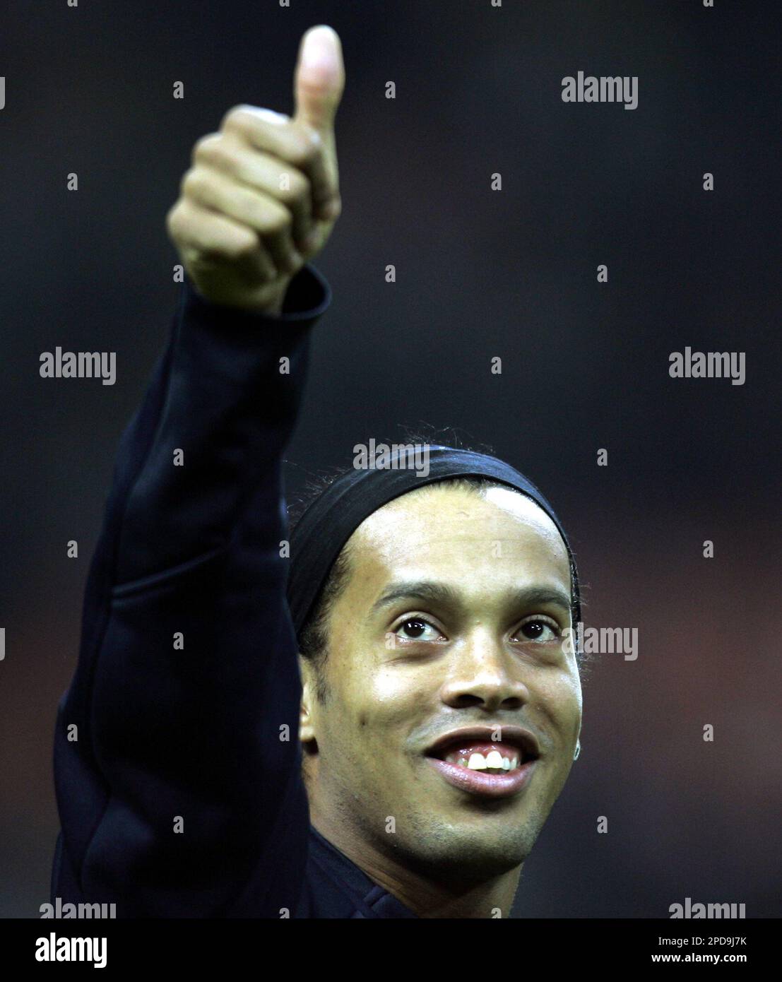 Barcelona Brazilian soccer star Ronaldinho waves to fans as he arrives ...