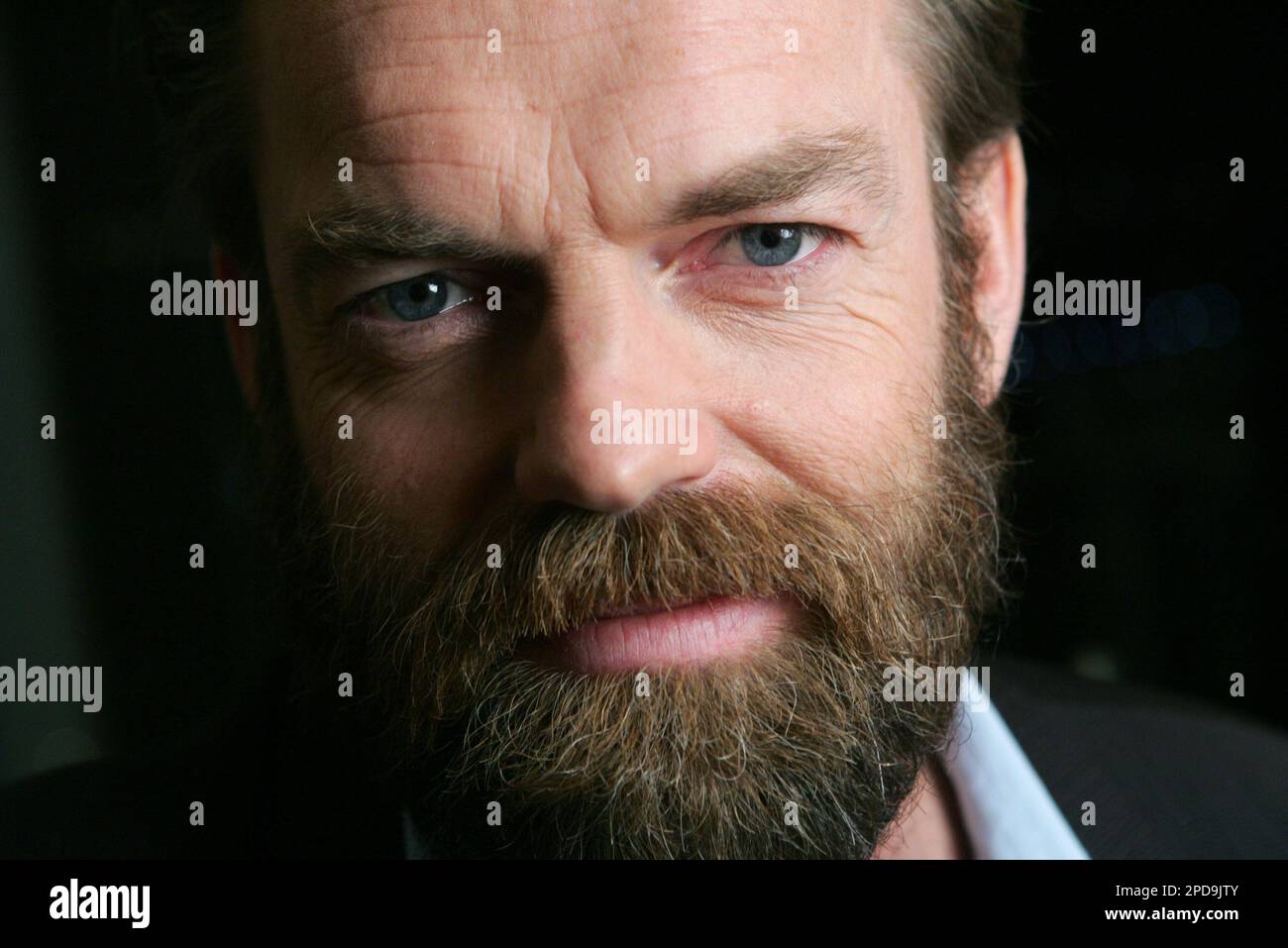 Actor Hugo Weaving poses during a photo session Sunday, Feb. 26, 2006 ...