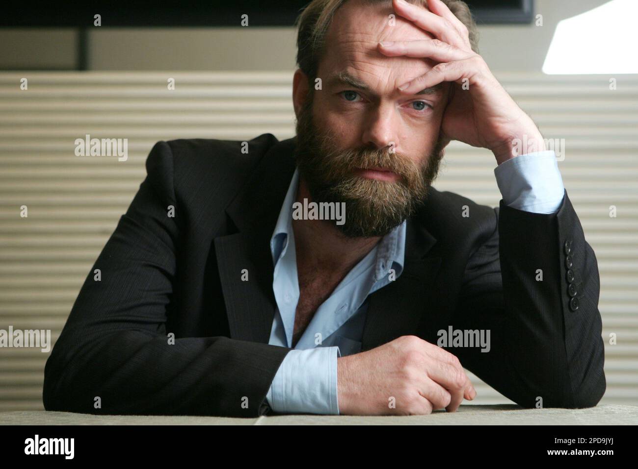Actor Hugo Weaving poses during a photo session Sunday, Feb. 26, 2006 ...