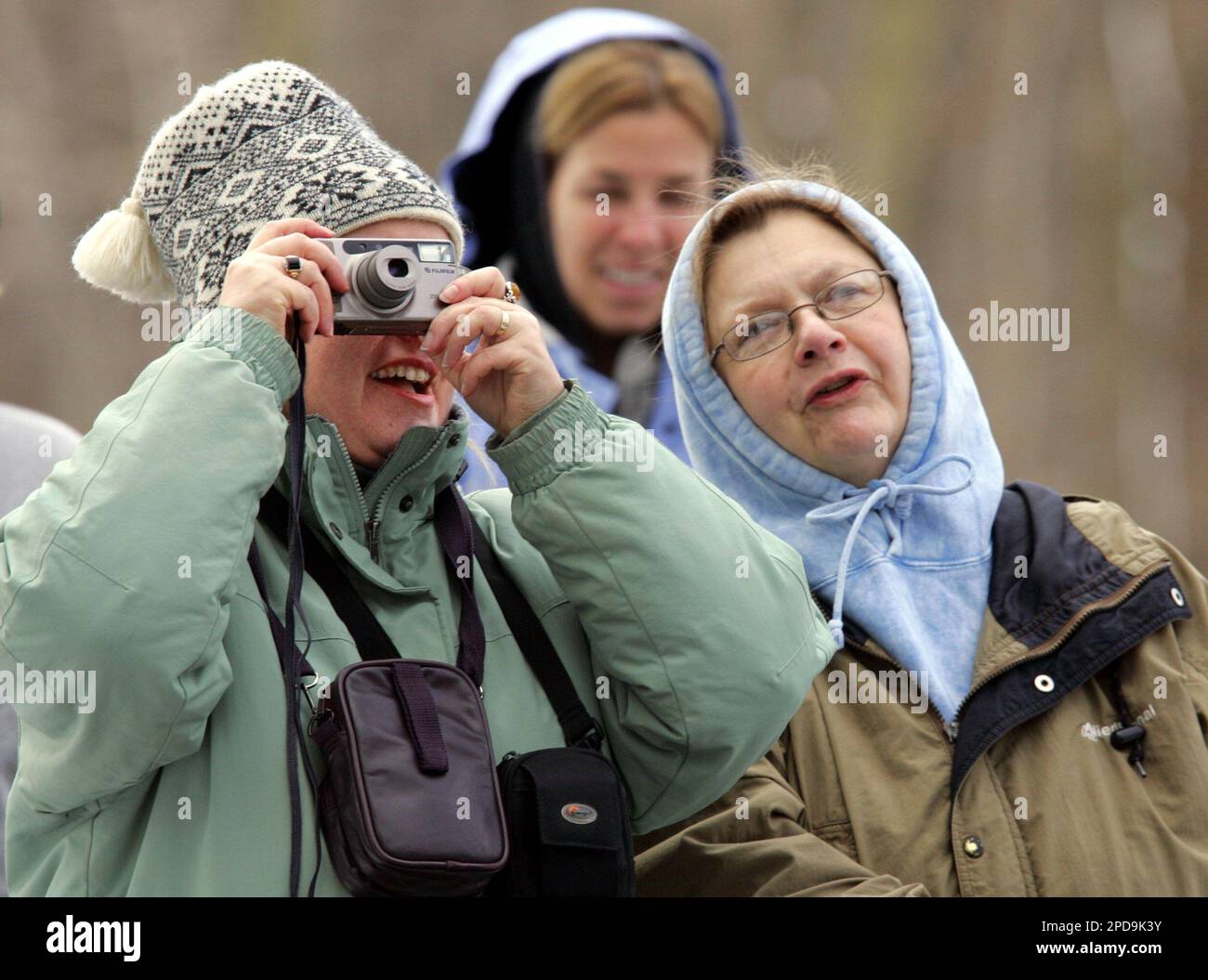 Sylvia Daniels, left, from Carey, Ohio, snaps a photo while her friend ...