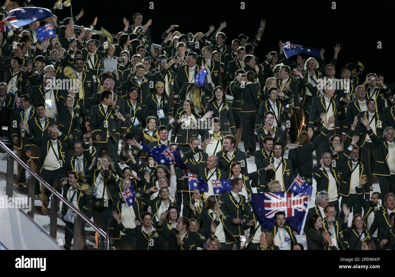 Australian athletes wave as they parade the Melbourne Cricket Ground ...