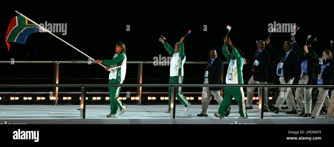 Natalie Du Toit leads the South African team into the arena during the ...