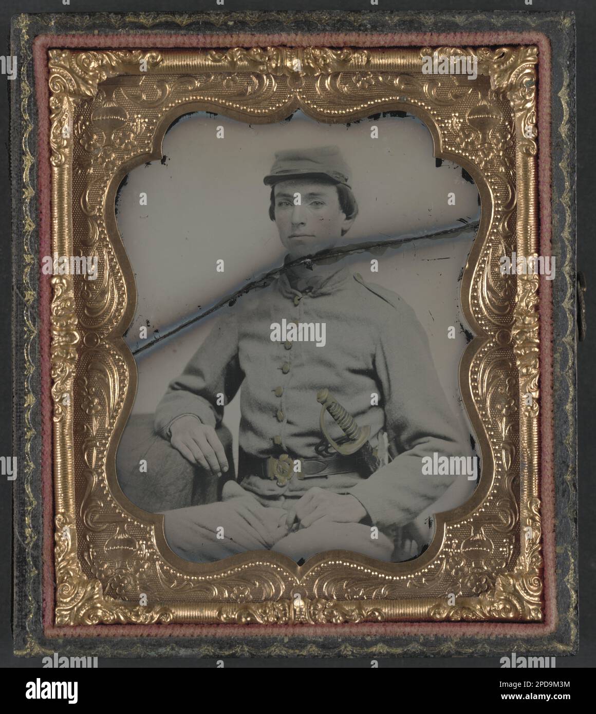 Unidentified soldier in Confederate uniform with early model two-piece ...
