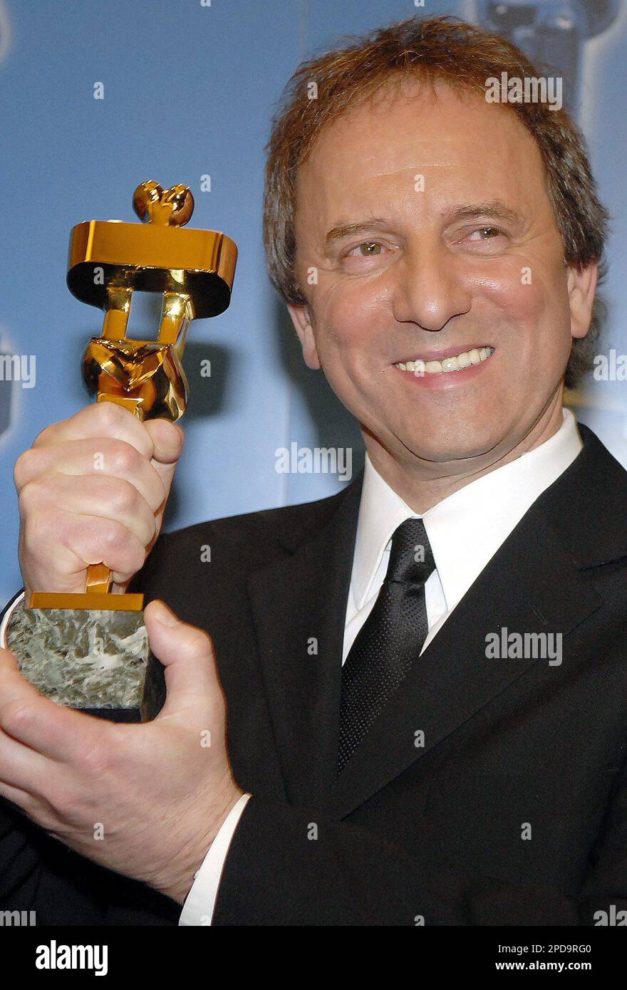 Actor Michel Cote poses with his award for Best Leading Actor for his ...