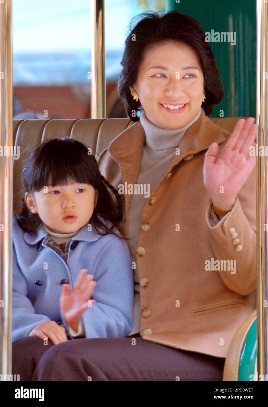 Japan's Princess Masako and her daughter Princess Aiko wave as they are ...