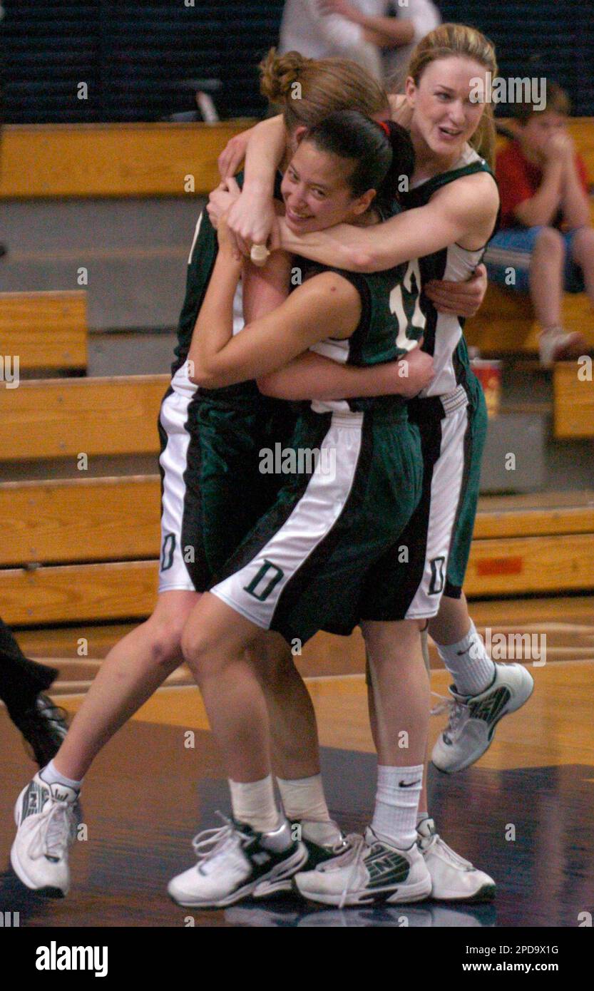 Dartmouth's Krista Perry left, embraces Angie Soriaga center, and ...