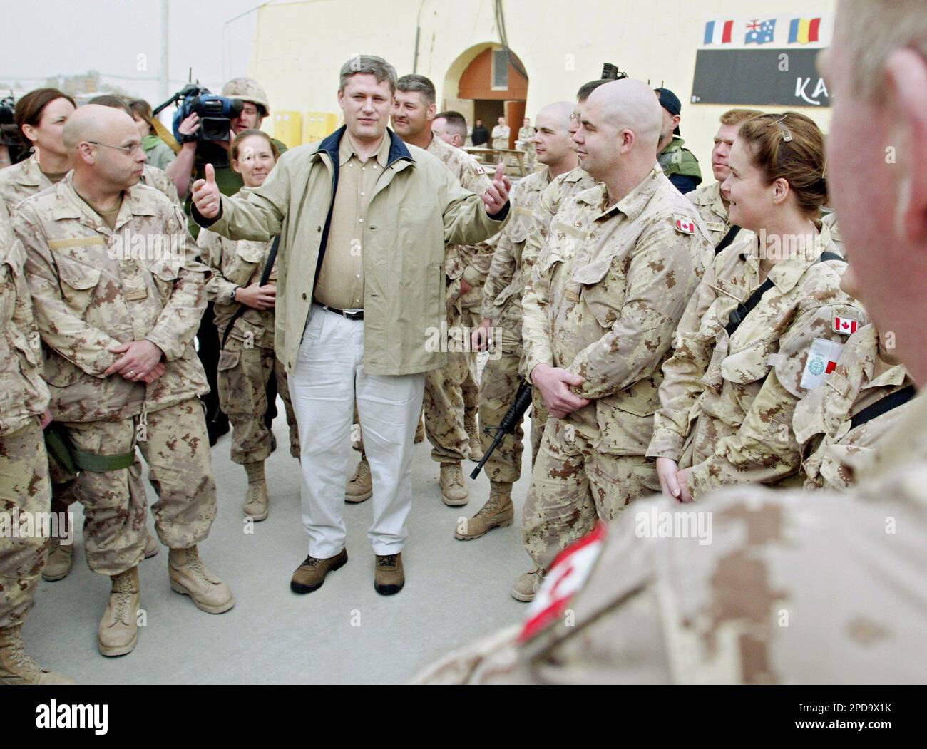 Prime Minister Stephen Harper chats with Canadian soldiers upon his ...