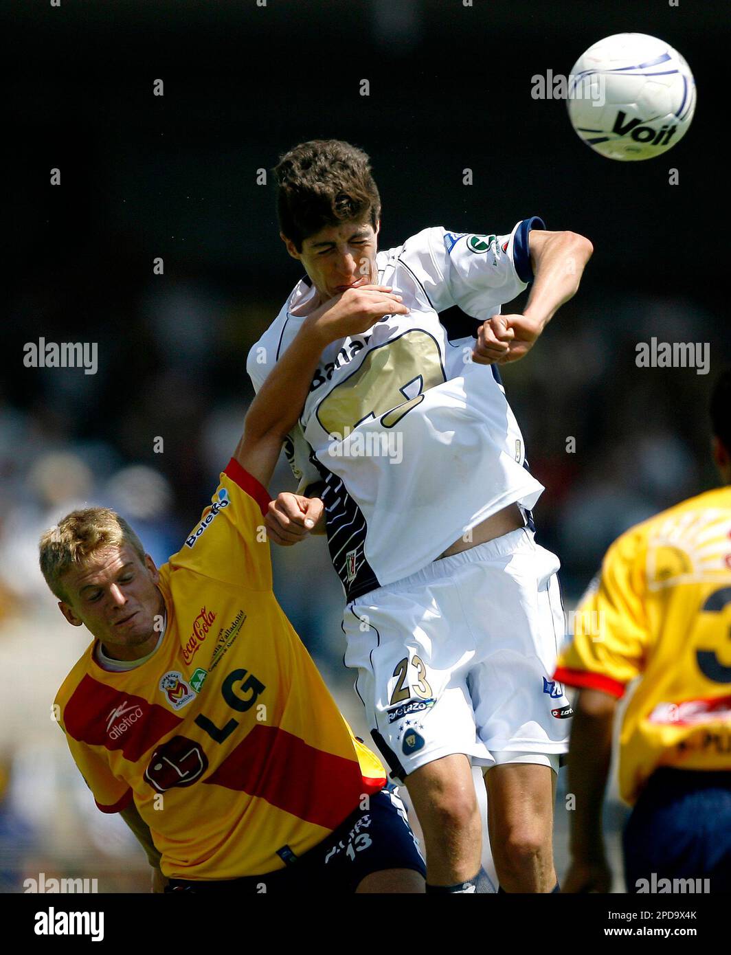 Pumas' soccer player Marco Palacios, top, fights for the ball with ...