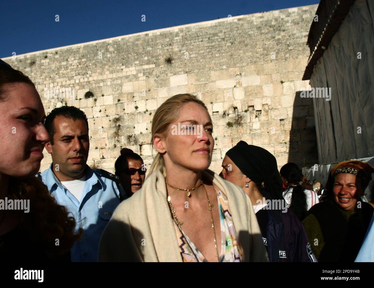 American actress Sharon Stone walks away after praying at the Western ...