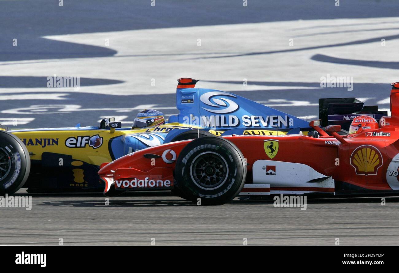Renault driver Fernando Alonso of Spain overtakes the Ferrari of ...