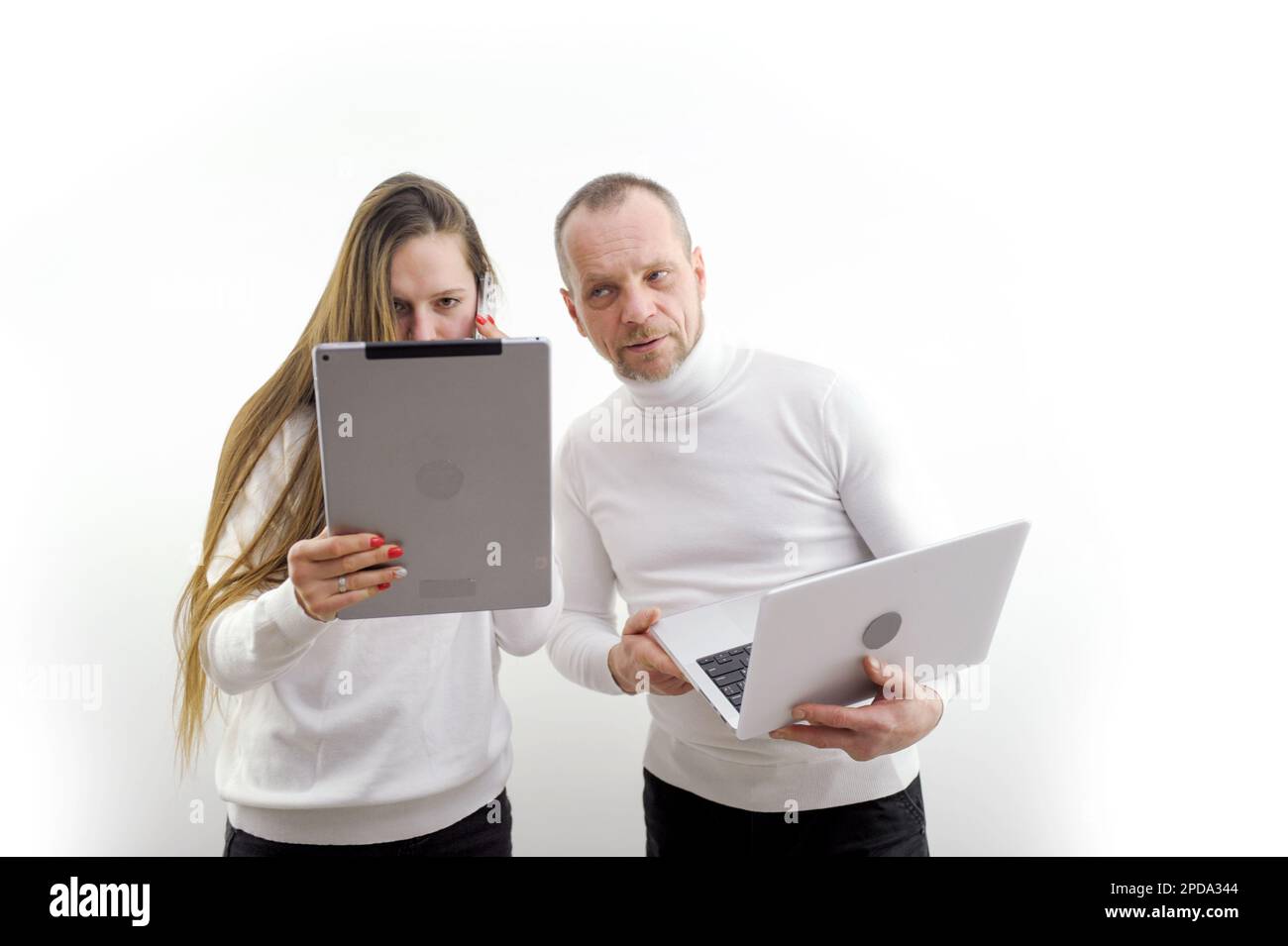 important Call on phone girl with tablet in hands talking focused and ...