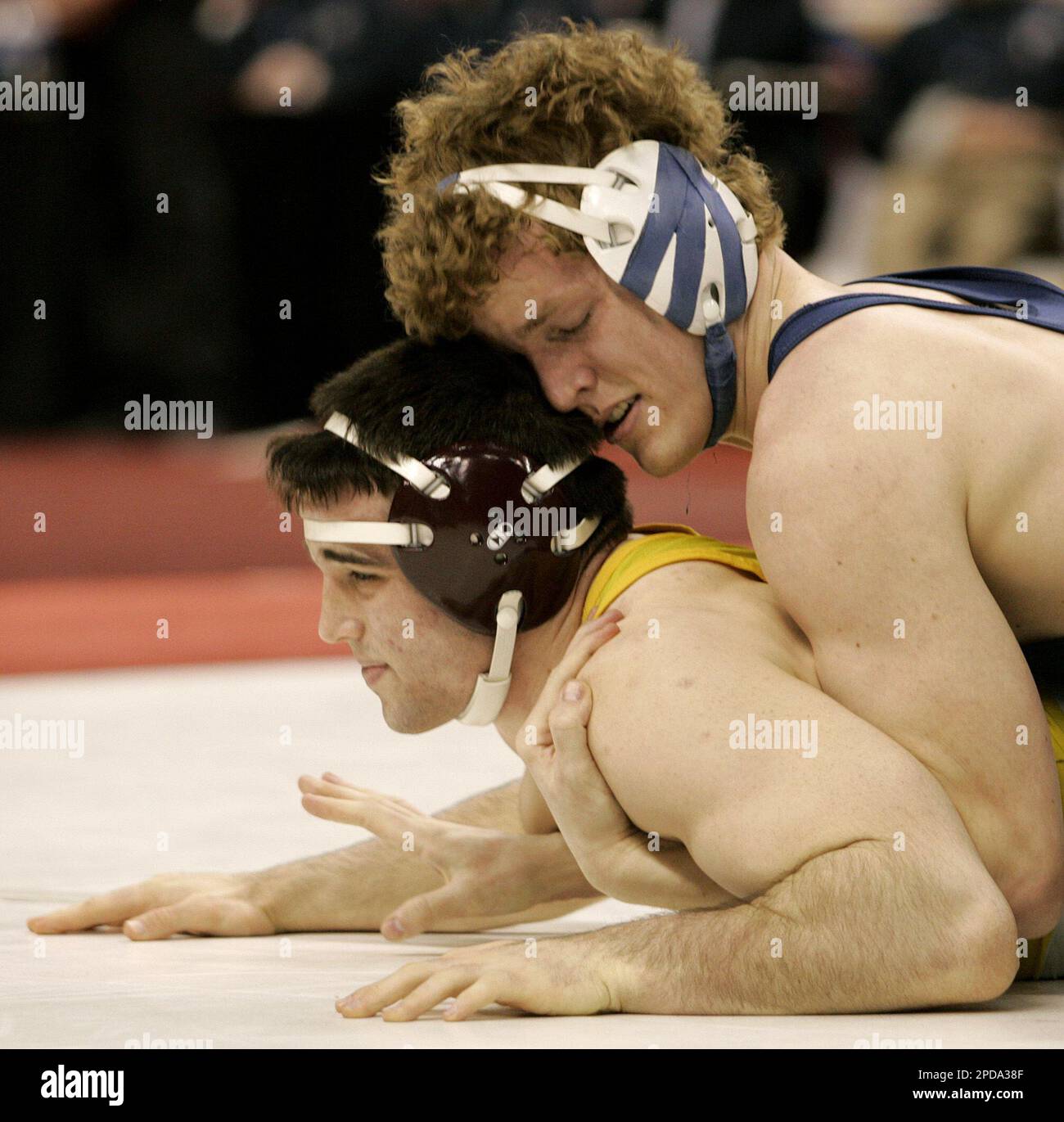 Quakertown's Pat Flynn, right, wrestles with McGUffey's Garrett Hunter ...