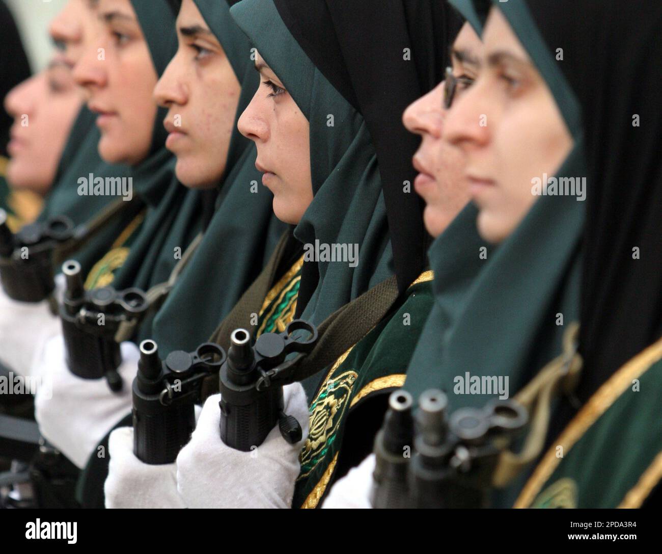 Iranian female police officers, wearing chadors stand at attention ...