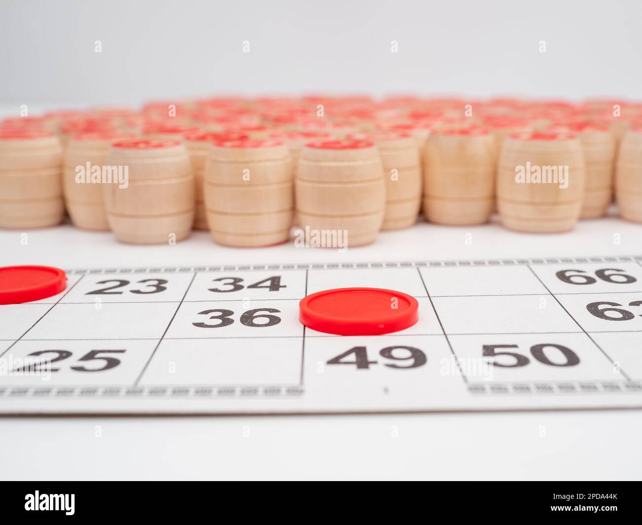 Board game bingo. Wooden barrels with lotto numbers, playing cards for ...