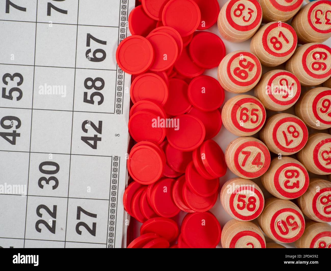 Board game bingo. Wooden barrels with lotto numbers, playing cards for ...