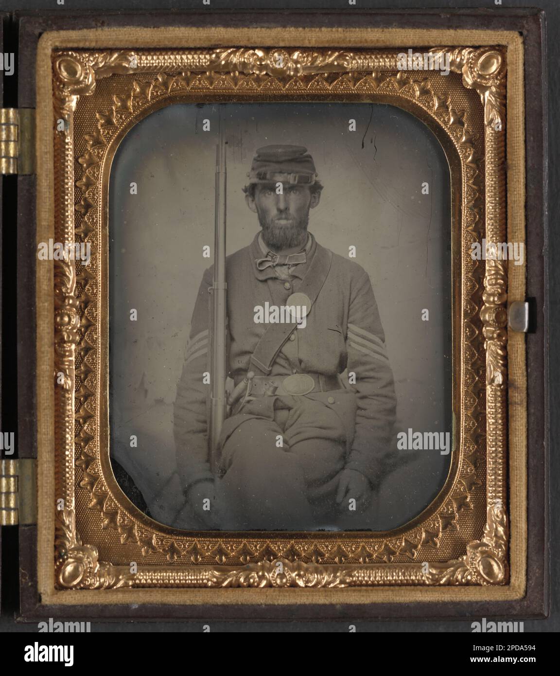 Unidentified soldier in Union sergeant's uniform with musket and sword ...