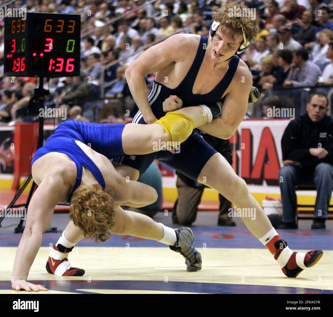 Quakertown's Pat Flynn, right, wrestles Canon McMillan's Ben Maud in ...