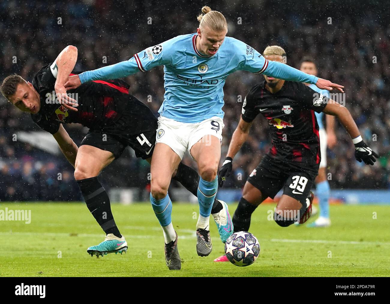 Manchester City's Erling Haaland (centre) and Red Bull Leipzig's Willi ...